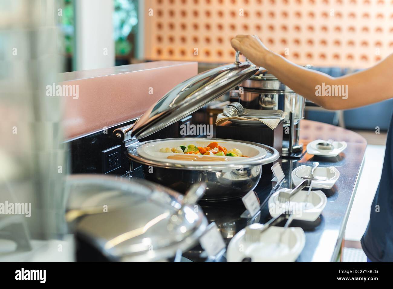 Woman hand taking food in buffet line indoor in hotel Stock Photo - Alamy