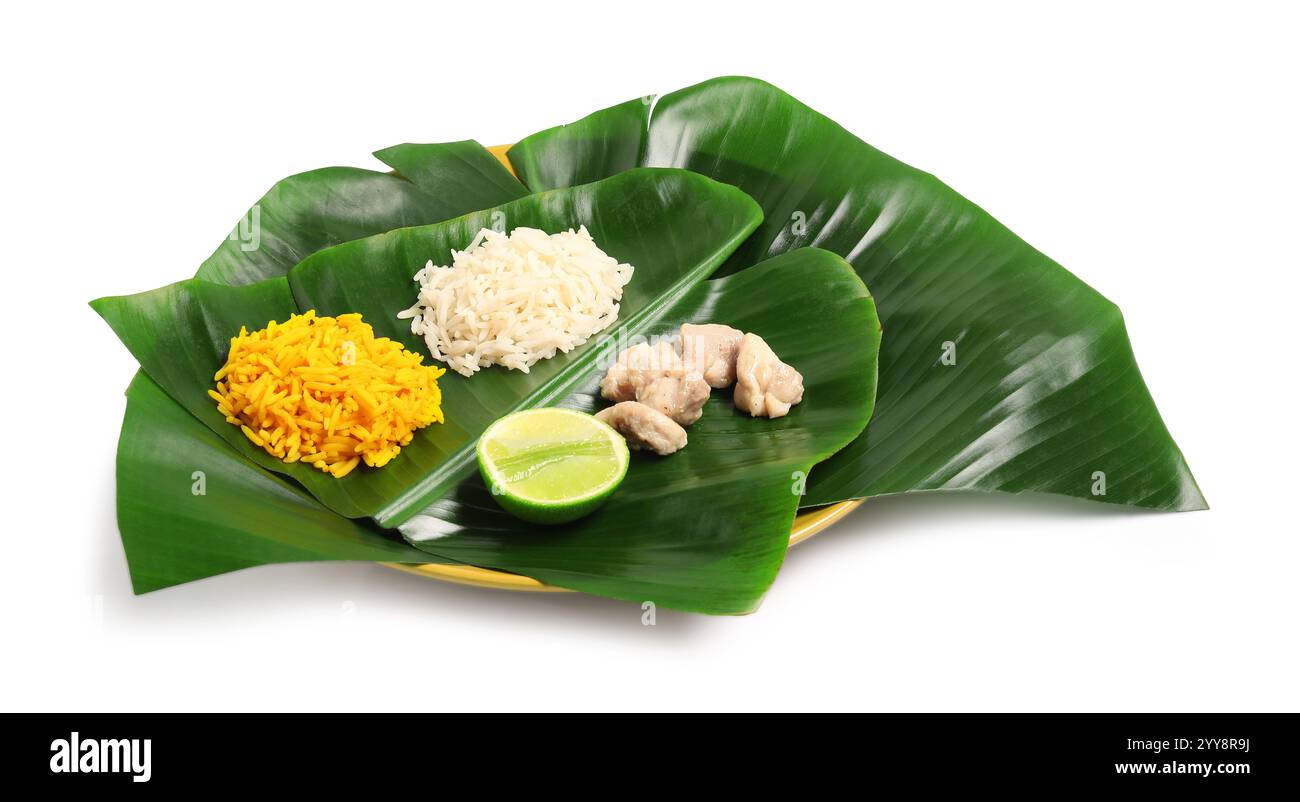 Cut banana leaves with different food isolated on white. Healthy eco ...