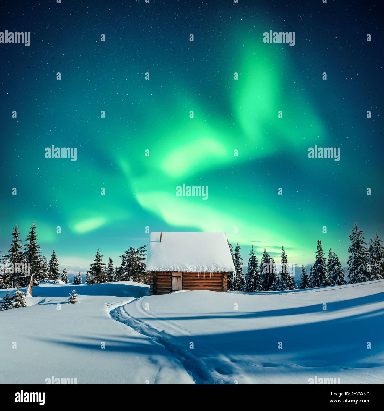 Old wooden cabin in snowy mountains under incredible Northern lights in ...