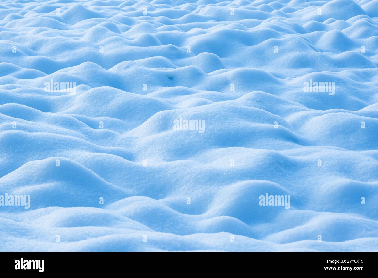 Christmas winter background from blue snow waves on snowy field Stock ...