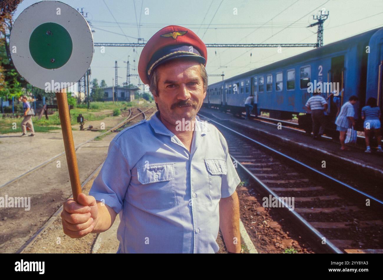 Hungary, Rail Worker Train Conductor Signals Departure At railway ...