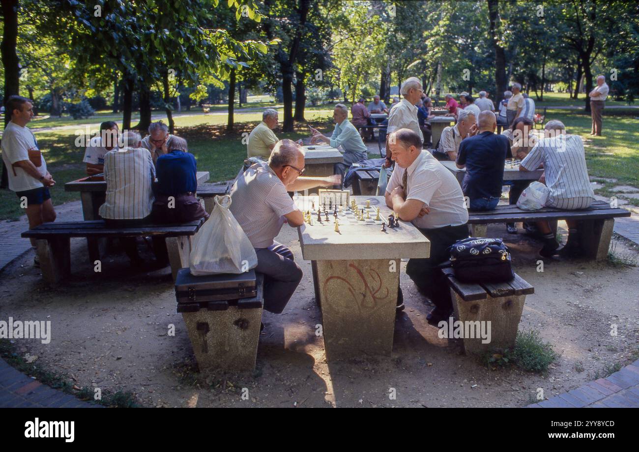 Hungary, Budapest, men play chess in the city's Főkert Park Stock Photo ...