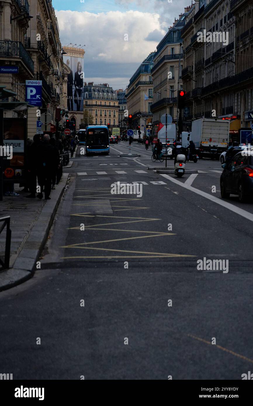 City street in Paris showcasing public transport, vehicles, pedestrians ...