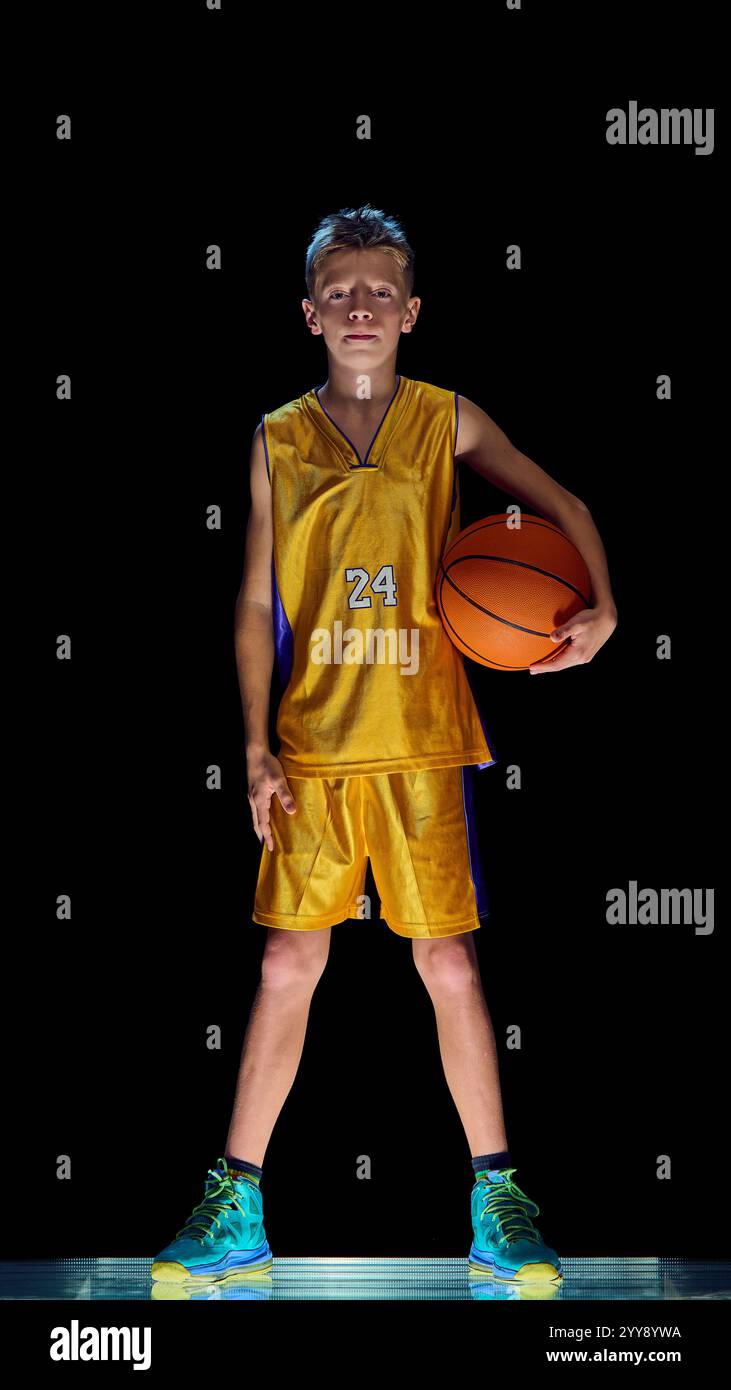 Full length portrait of young attractive junior basketball player ...