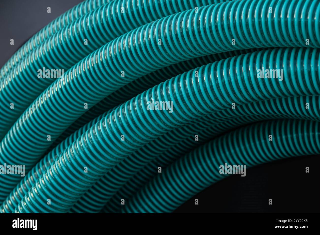Green corrugated flexible pipe or hose, pvc tubes Stock Photo - Alamy