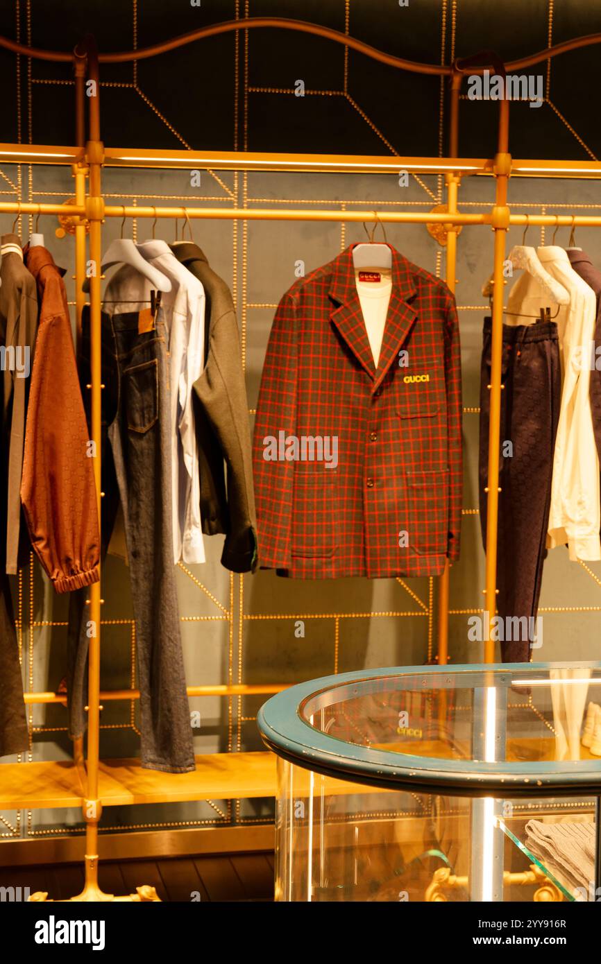 Elegant fashion display of various attire in a boutique during a ...