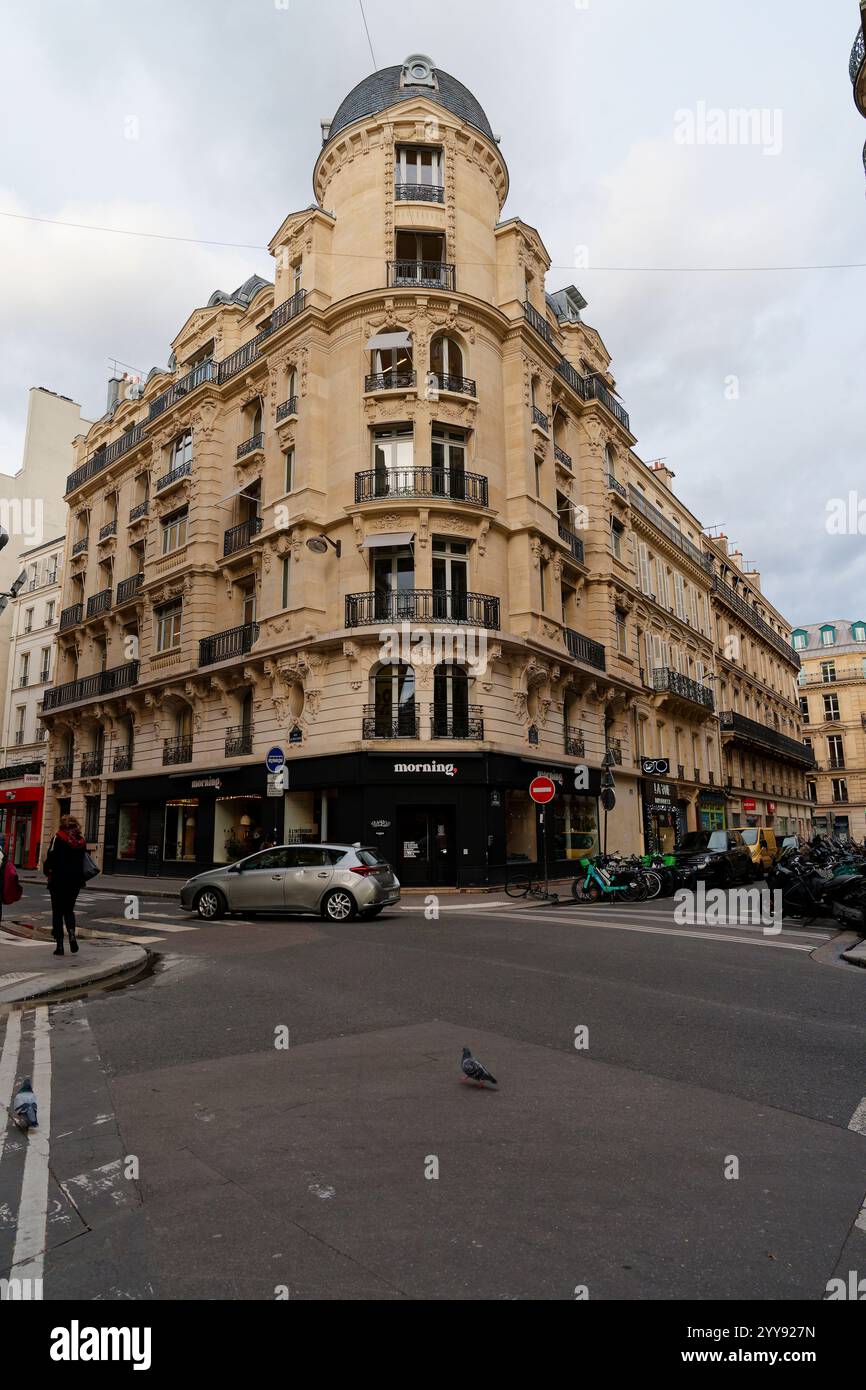 Charming Parisian street corner with elegant architecture and morning ...