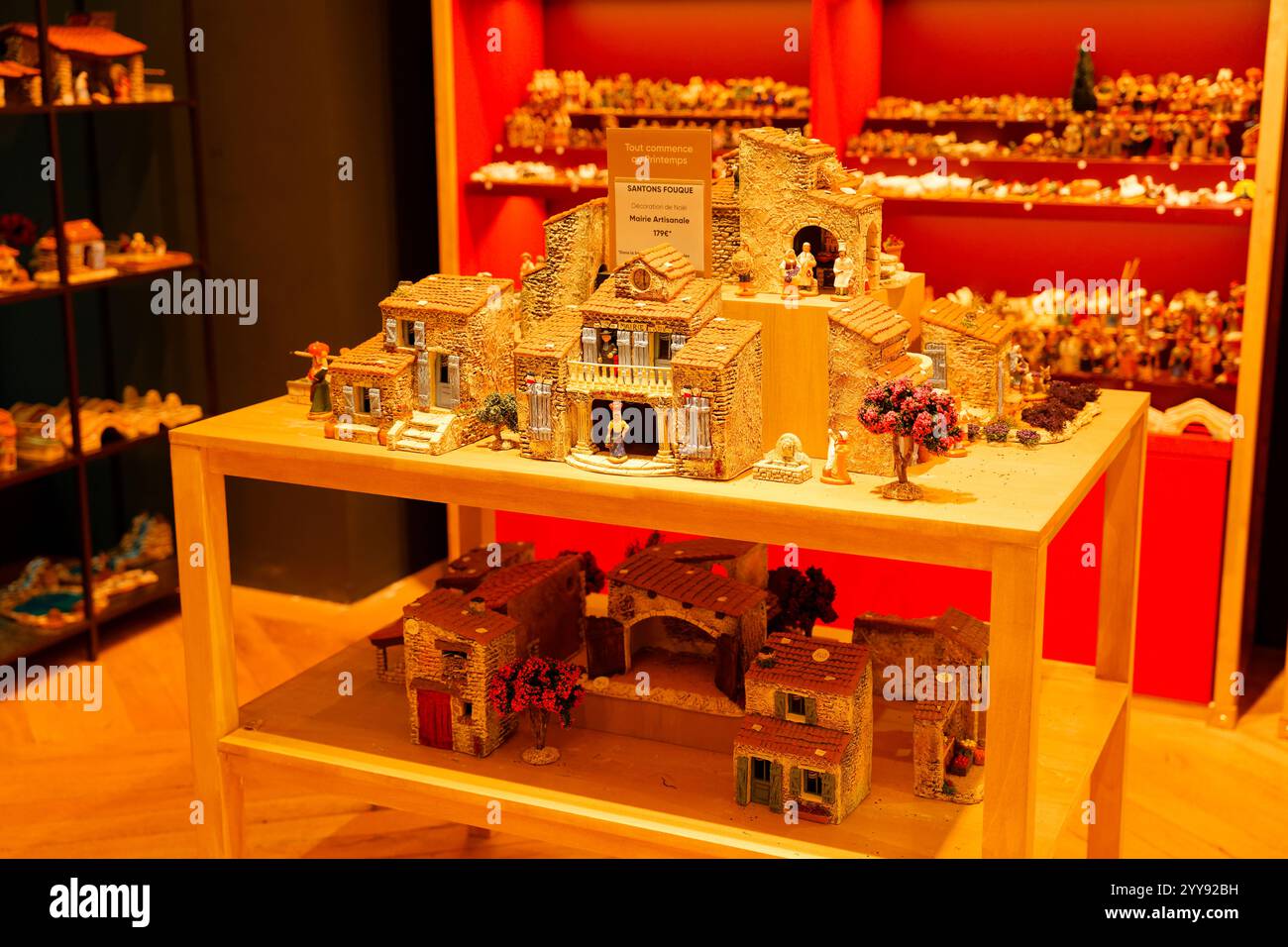 Miniature village display features intricate craftsmanship in a vibrant ...