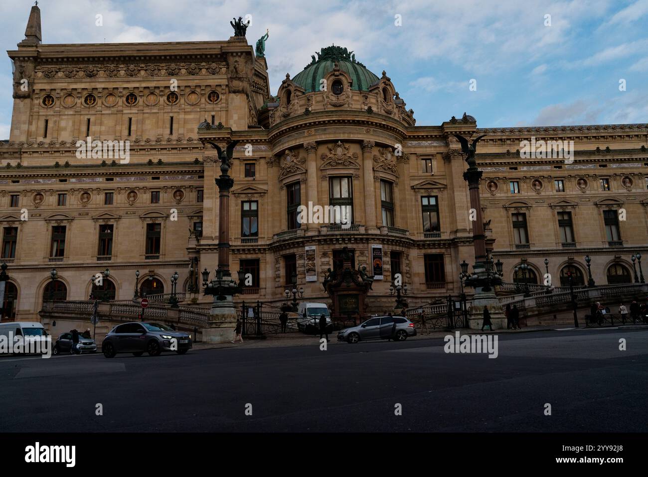 Historic building with ornate architecture and statues during early ...