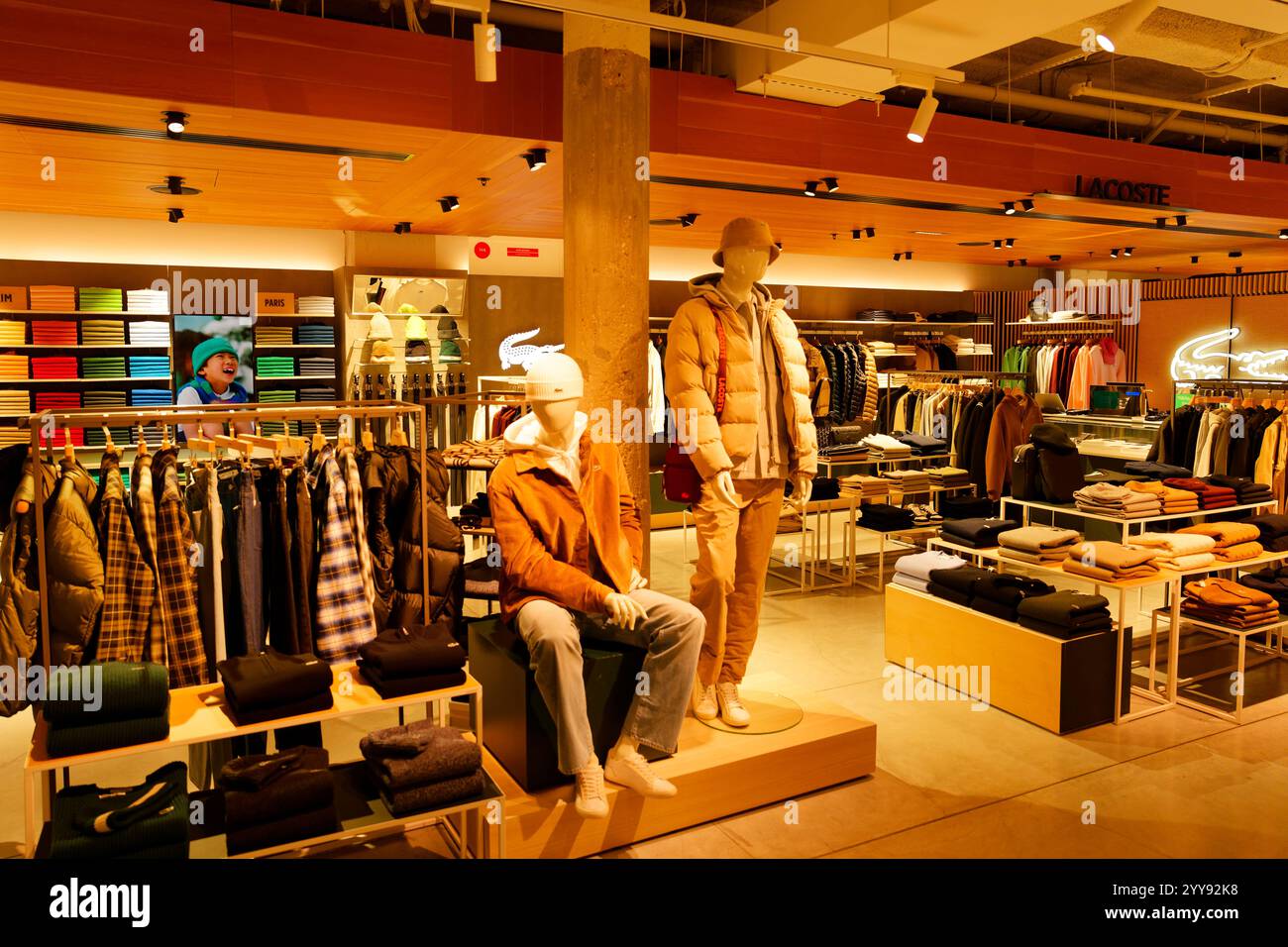 Fashion store interior featuring stylish clothing displays and ...