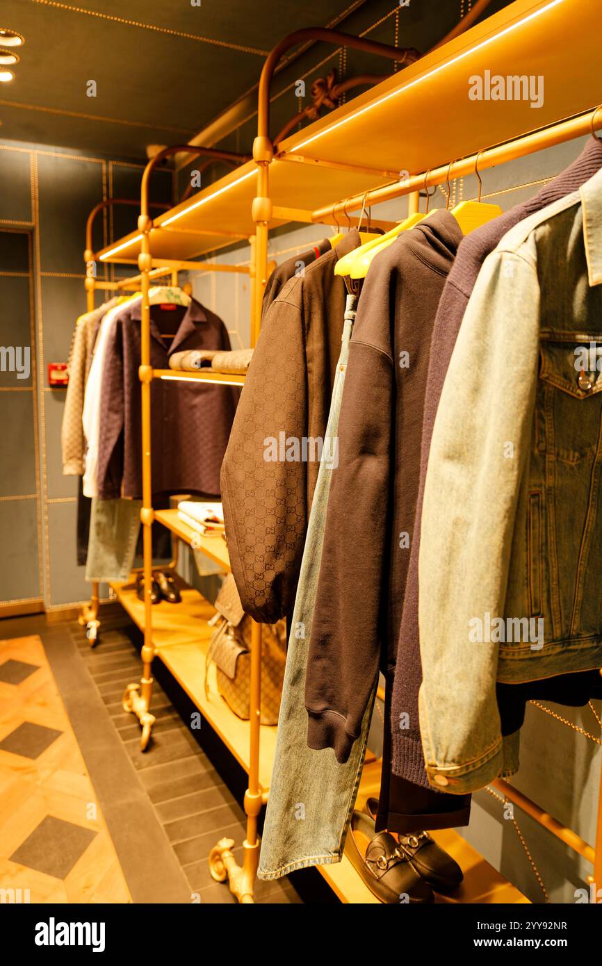 Clothing rack displaying a variety of garments in a stylish boutique ...