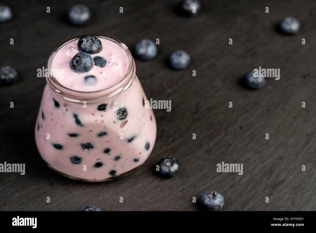 blueberry and berry-flavored yogurt, blueberry yogurt with slices and ...