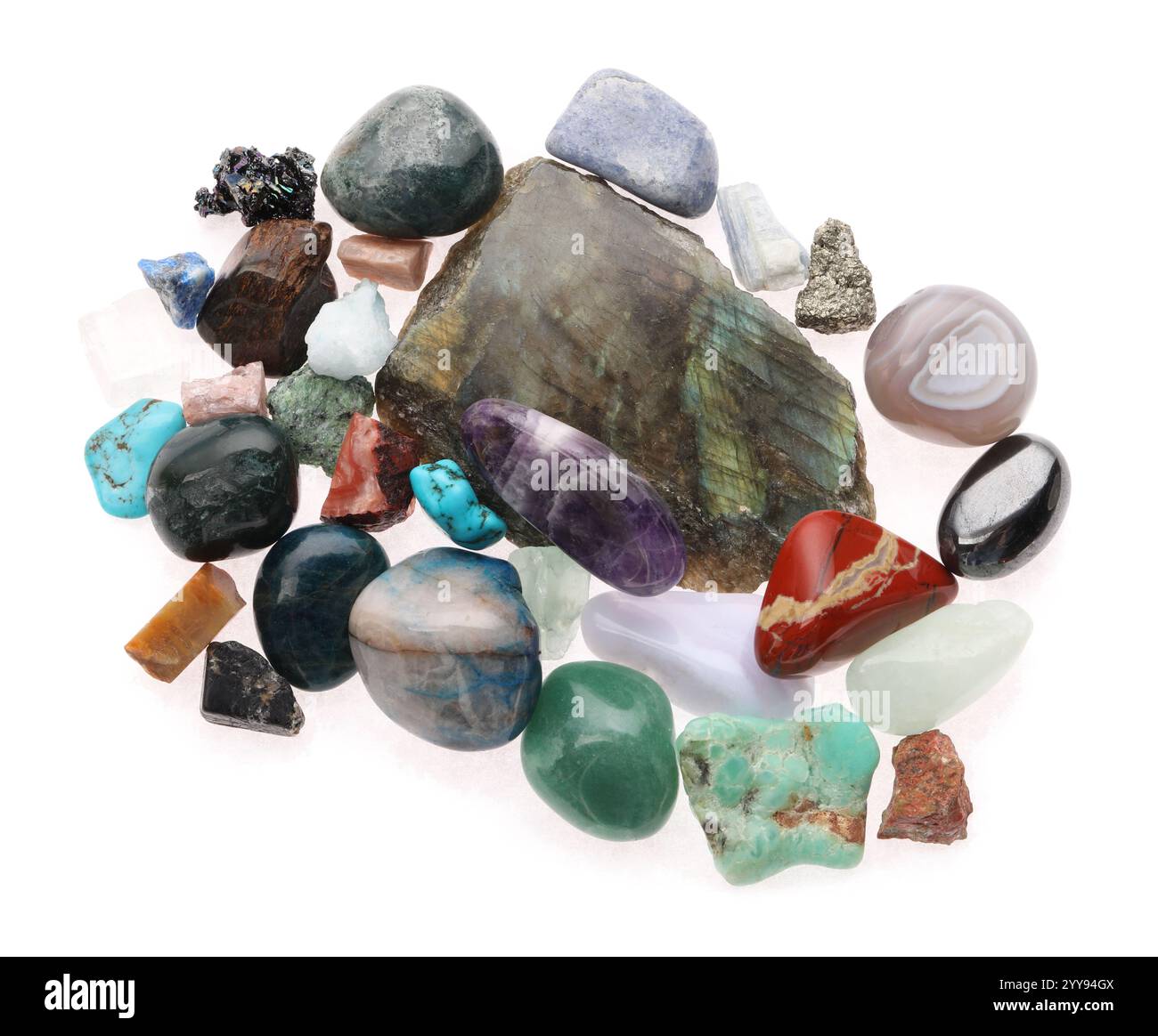 Pile of different natural mineral stones isolated on white, top view ...