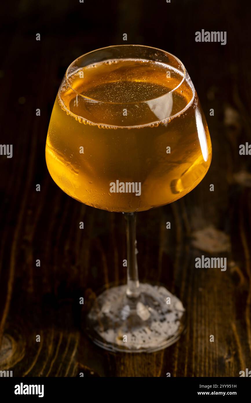 bubbles of apple juice with grape juice, cold apple juice drink in a ...