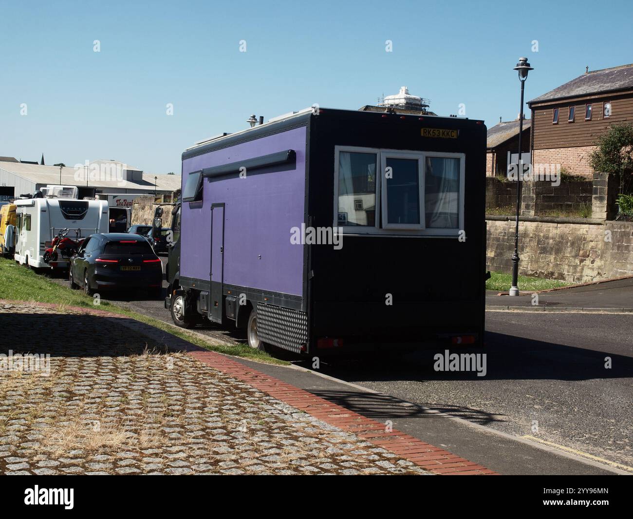 People living an alternative lifestyle in a box truck lorry van ...