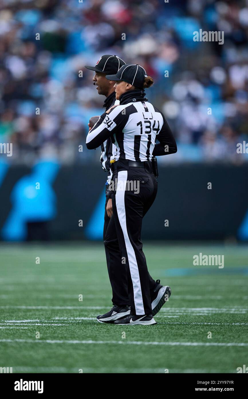 Line judge Robin DeLorenzo (134) chats with umpire Scott Walker (11 ...