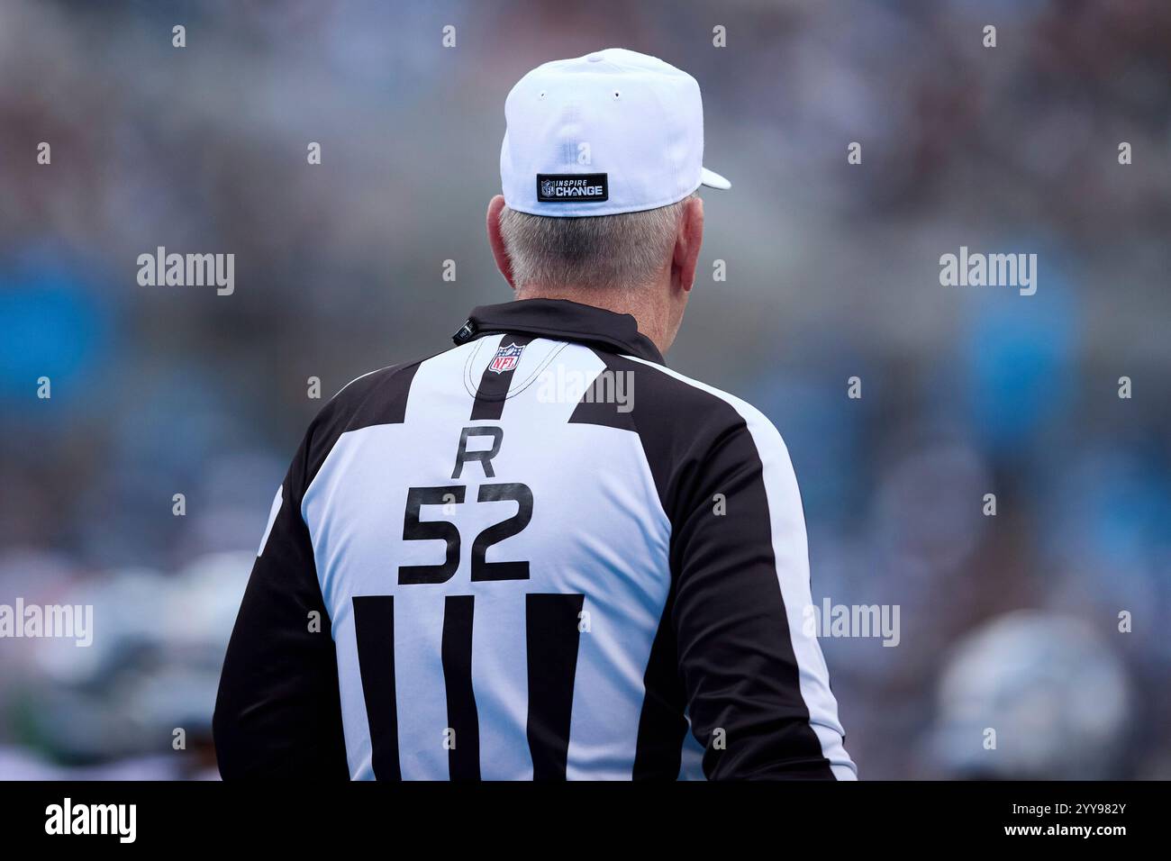 Referee Bill Vinovich (52) wears an "Inspire Change" patch on the back ...