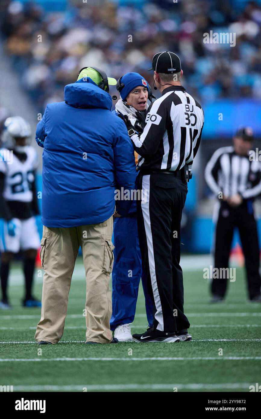NFL timeout coordinator Rene Caplan has a conversation with back judge ...
