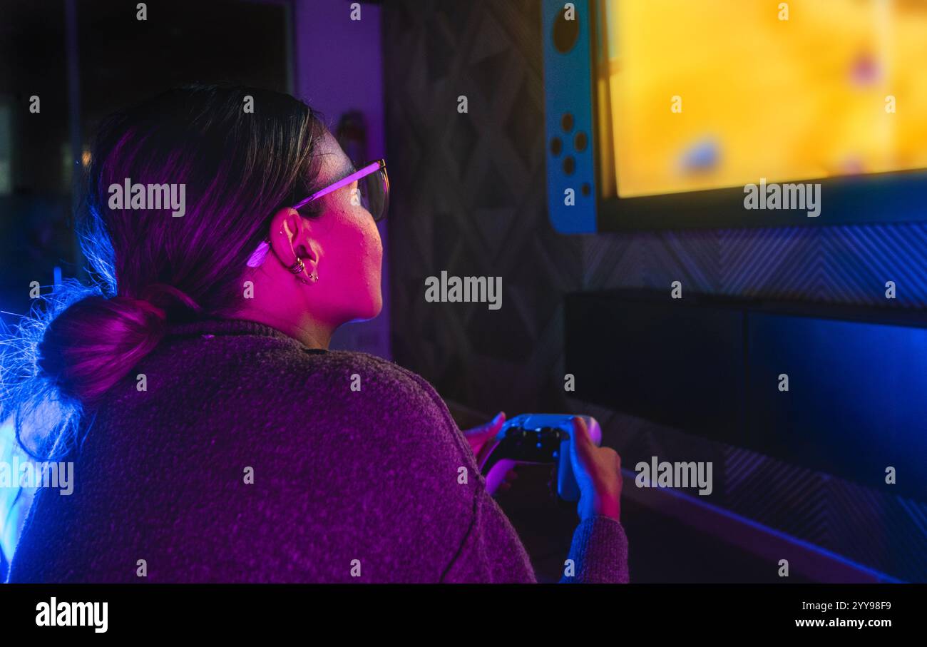 Excited young woman gamer wearing hi-res stock photography and images ...
