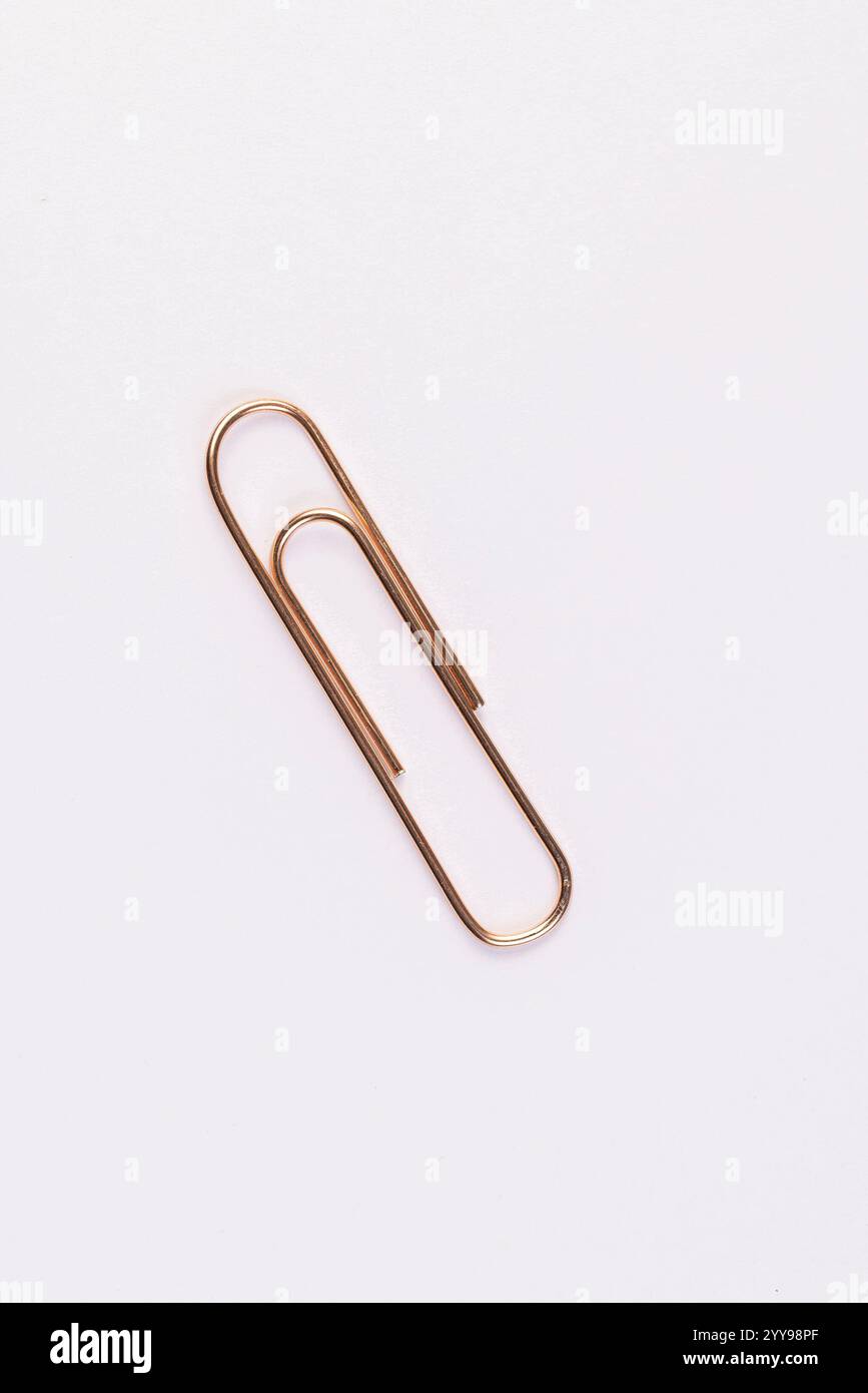 group of copper paper clips made of metal for the systematization of ...