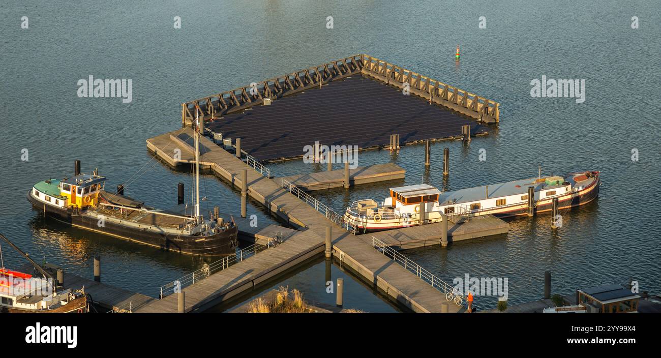 Overlook of floating deck on the Ijmeer river in Amsterdam at sunset ...