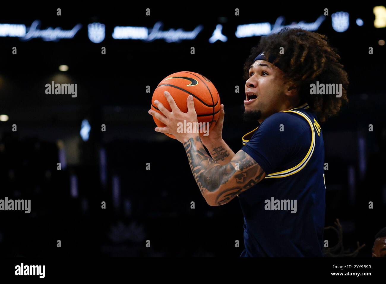 Michigan guard Tre Donaldson drives to the basket against Oklahoma ...