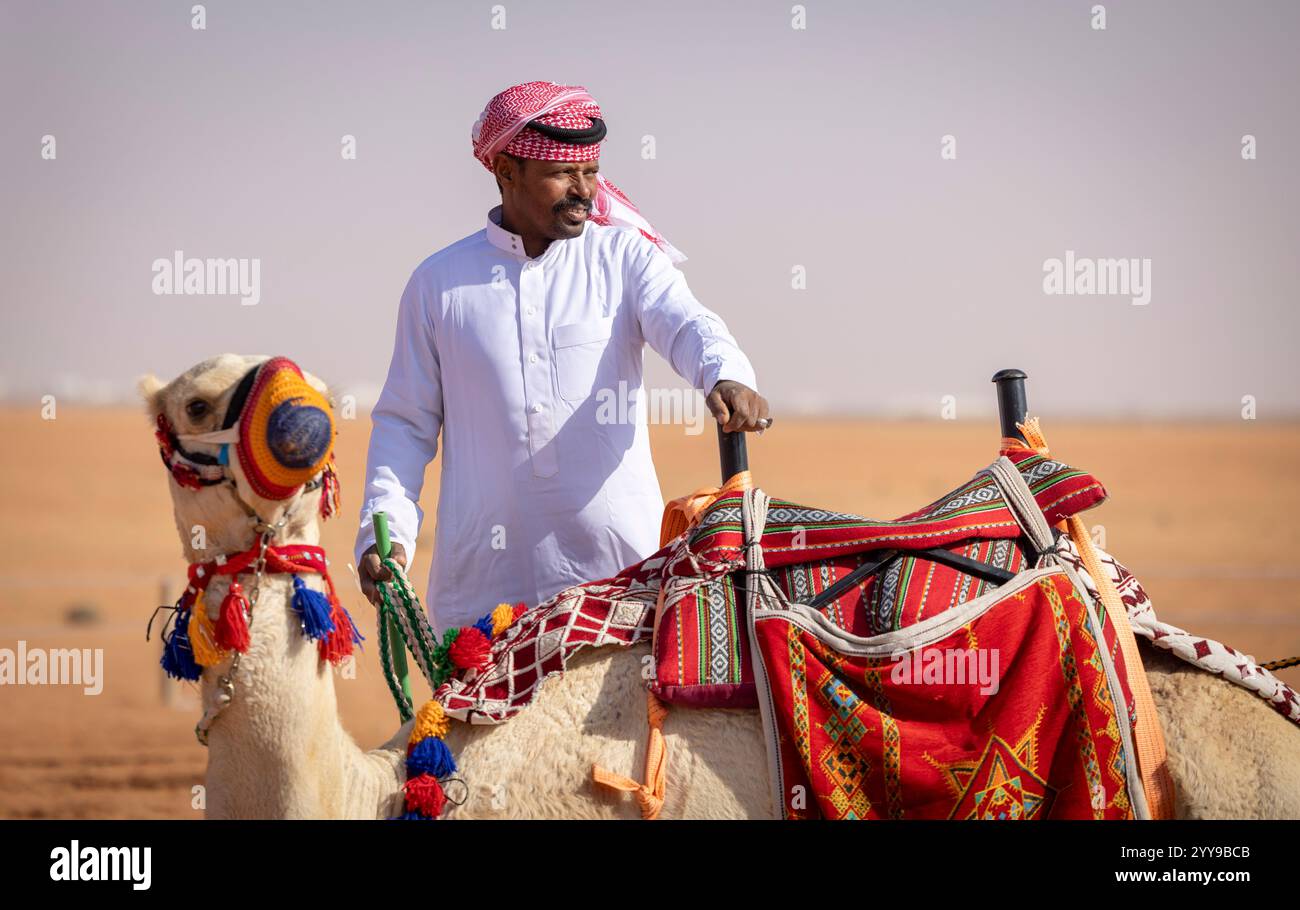 Al-Sayahid, KSA, 14th December 2024: camel rider in traditional ...