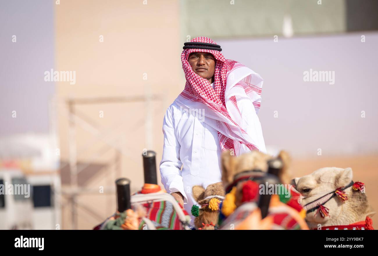 Al-Sayahid, KSA, 14th December 2024: camel rider in traditional ...