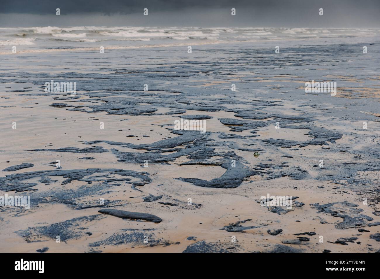 The sea and the beach are polluted with oil. Beach oil spill impact ...