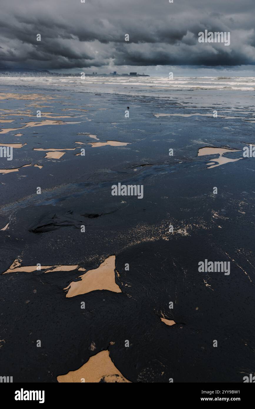 Oil leak in ocean coastline after a tanker wreck. Oil fuel polluted and ...