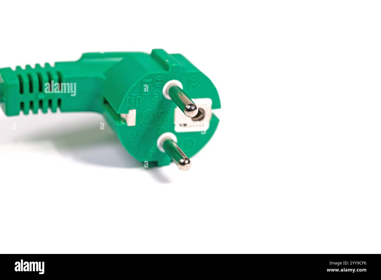 Green power plug against a white background Stock Photo - Alamy