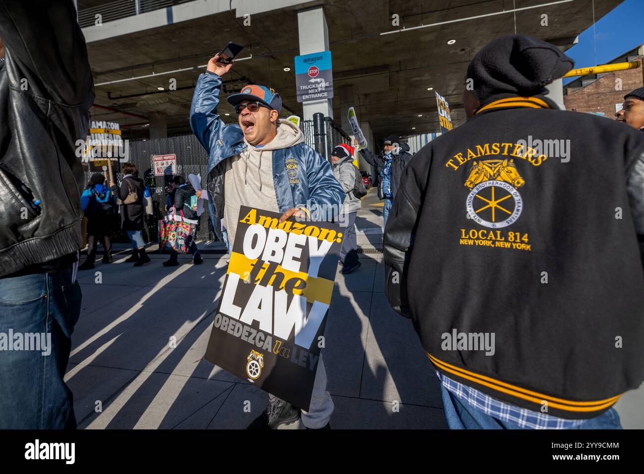 New York, United States. 19th Dec, 2024. Amazon workers? and members of ...