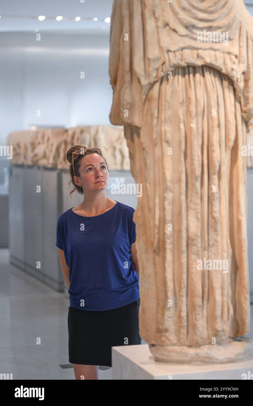 Acropolis Museum: young woman looking at a statue. Athens. Greece Stock ...