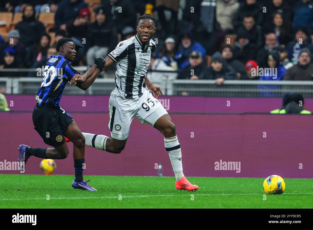 Milan, Italy. 19th Dec, 2024. (R-L) Souleymane Isaak Toure of Udinese ...