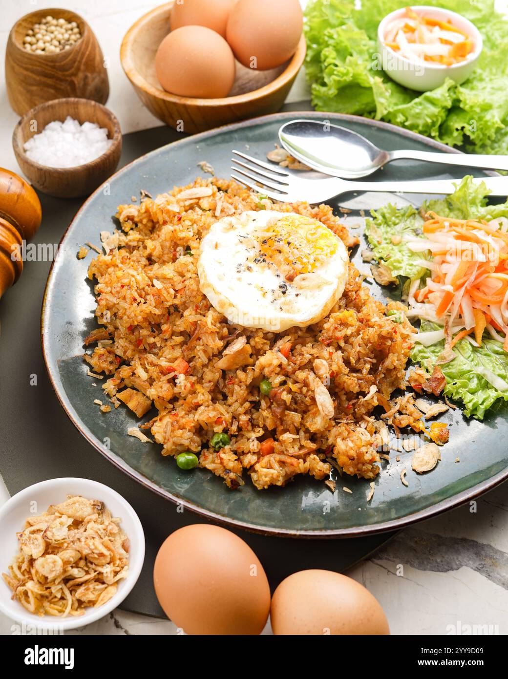 A vibrant plate of Vietnamese fried rice served on a banana leaf ...