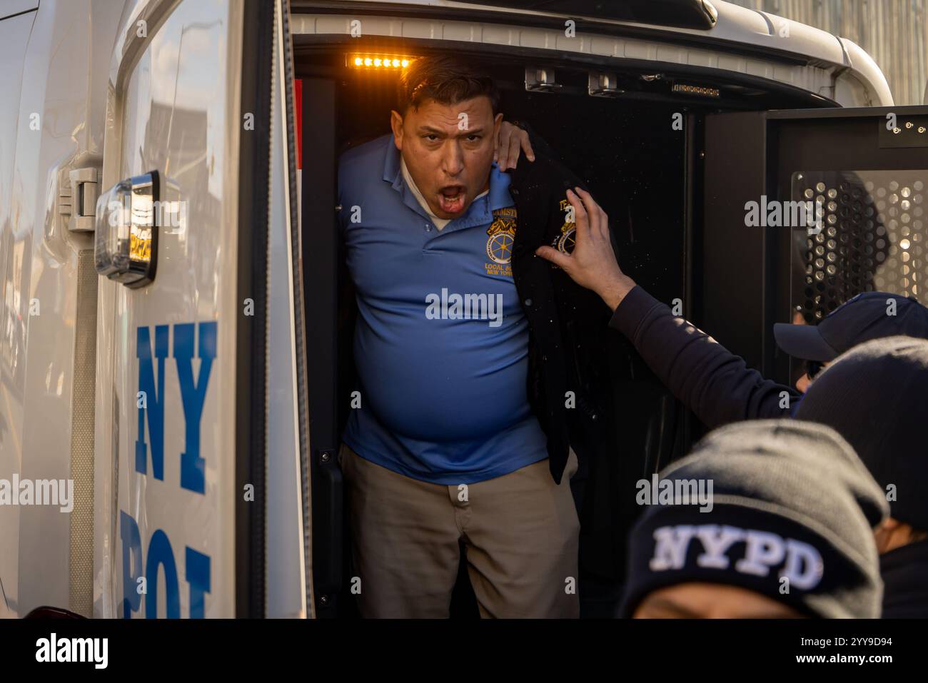 New York, New York, USA. 19th Dec, 2024. Teamster organizer Antonio ...