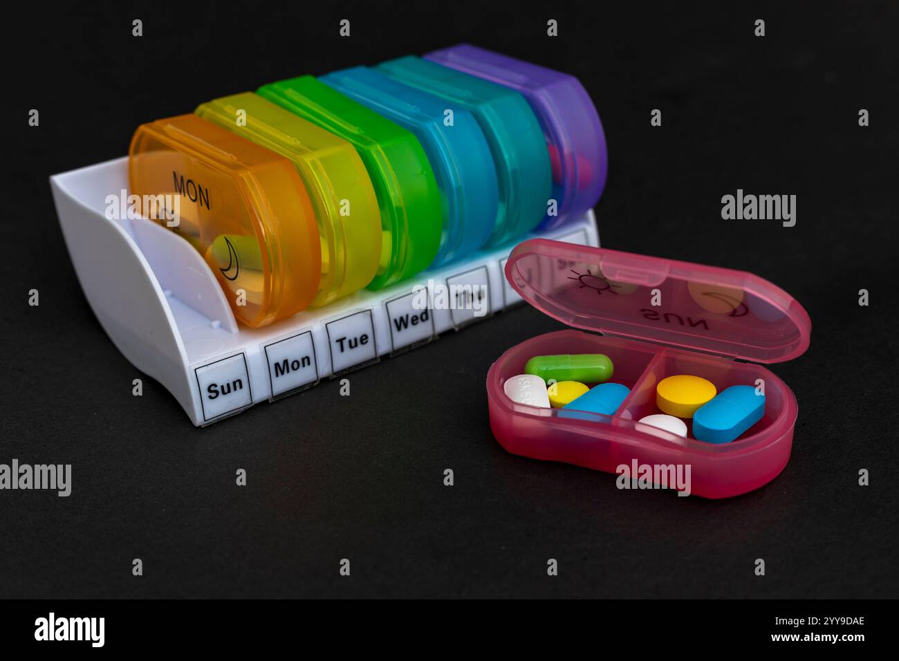 Daily drug dose or pills organizer boxes for a complete week days ...