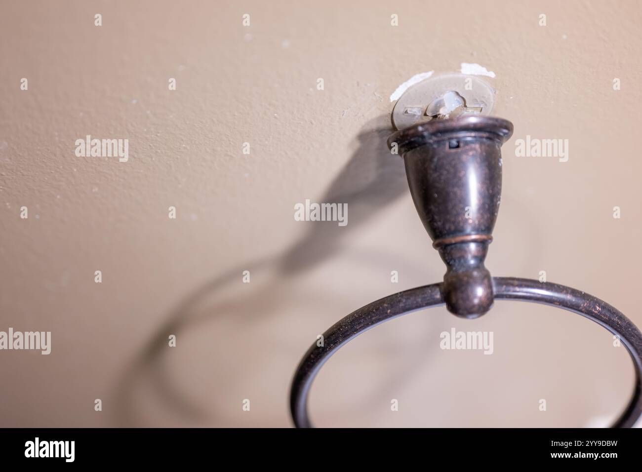 Wall fixture being pulled out of drywall because of a bad installation ...