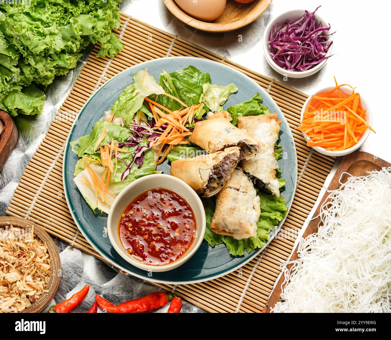 Crispy Vietnamese spring rolls (Chả Giò) served with fresh salad, sweet ...