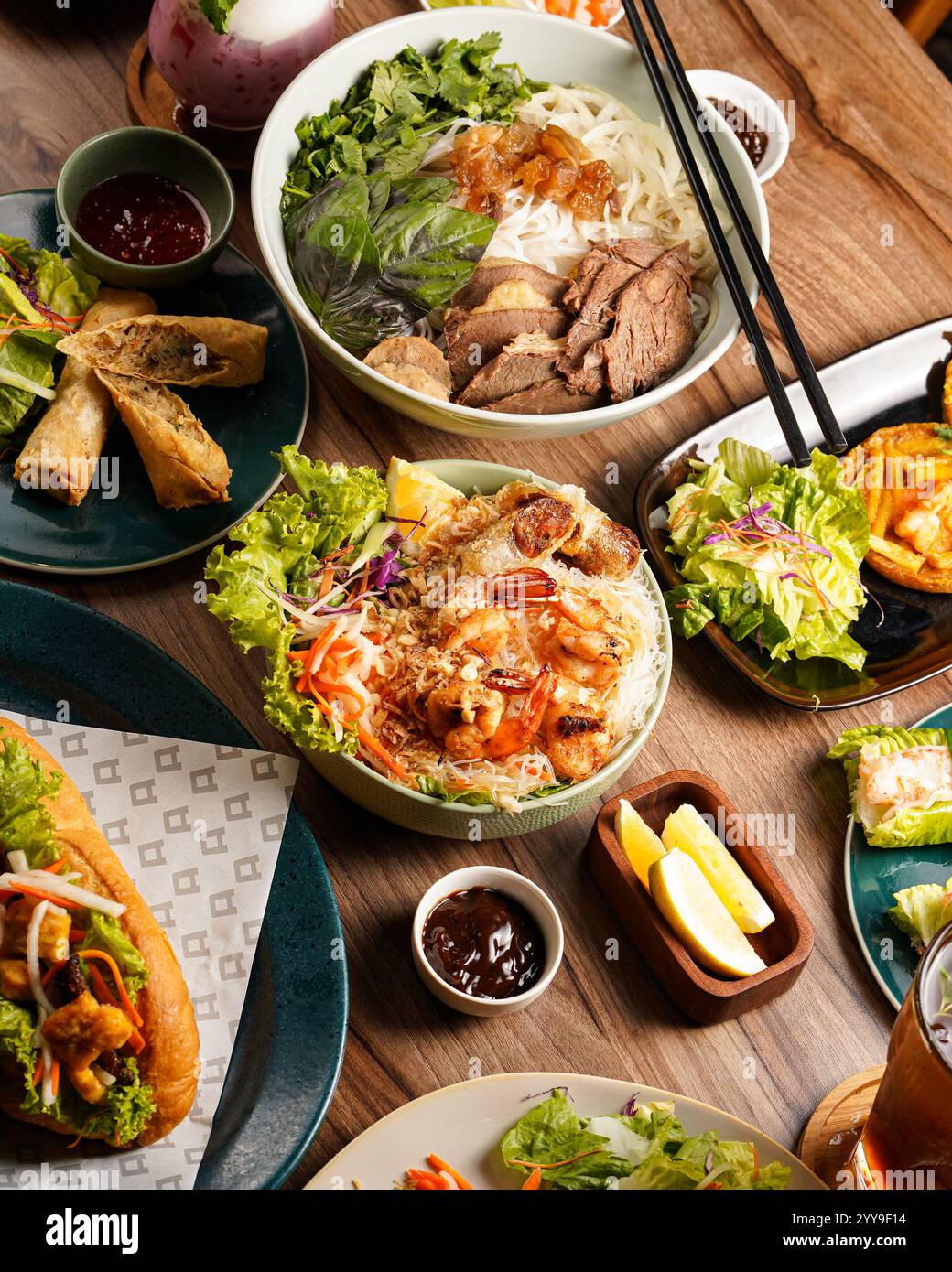 A colorful Vietnamese feast featuring fresh spring rolls, crispy egg ...