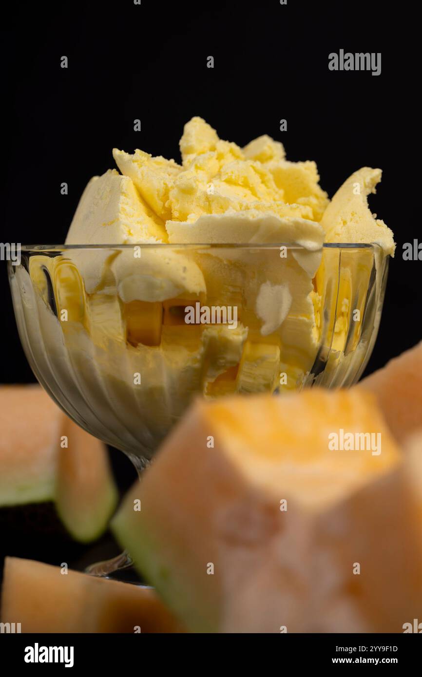cold melon-flavored ice cream and ripe orange melon cut into pieces ...