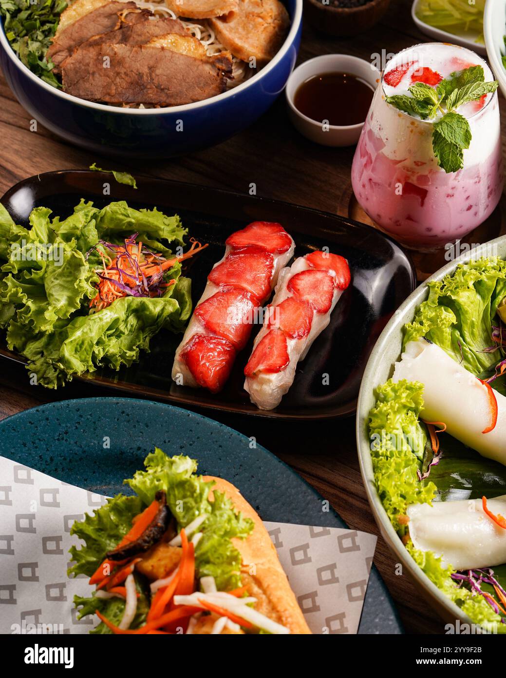 Assorted Vietnamese cuisine featuring strawberry fresh spring rolls ...