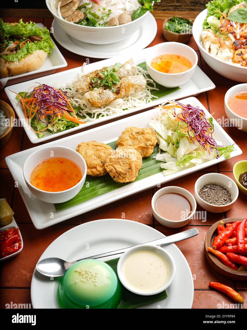 A vibrant assortment of traditional Vietnamese cuisine featuring pho ...