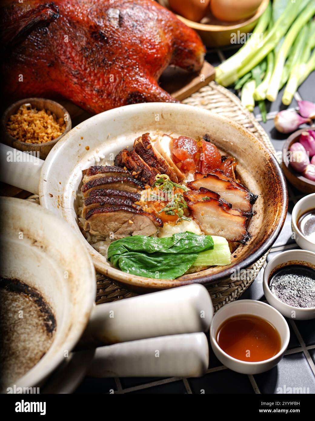 Traditional clay pot rice served with a variety of savory toppings ...