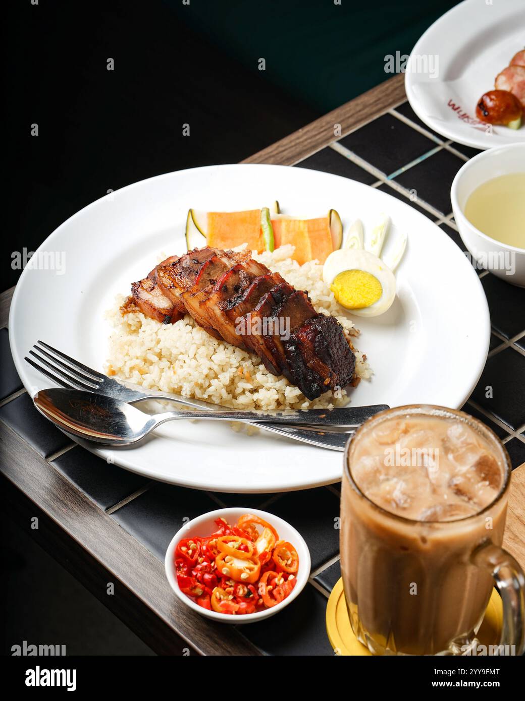 Traditional clay pot rice served with a variety of savory toppings ...