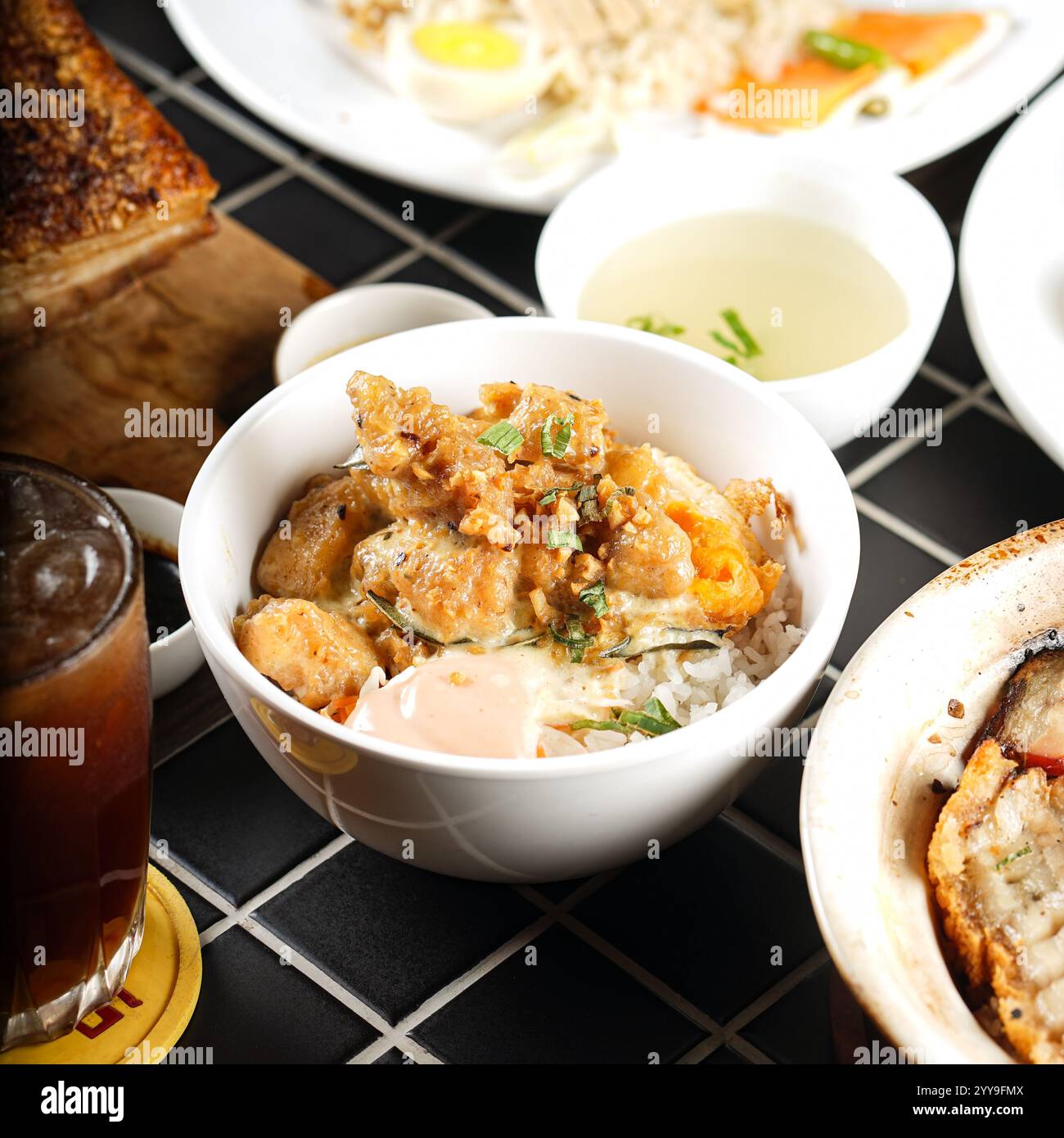 Traditional clay pot rice served with a variety of savory toppings ...