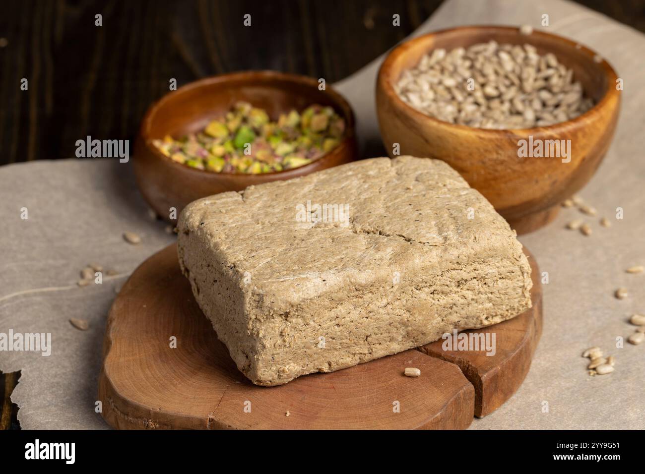 halva from sunflower seeds in a wooden bowlclose up one solid mass, a sweet delicious dessert ...
