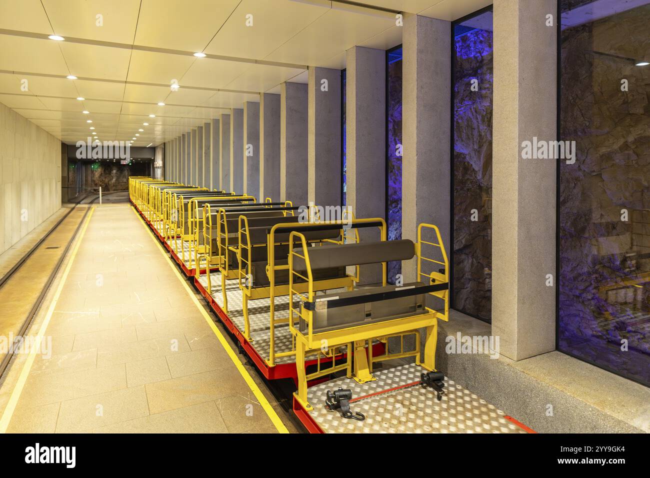 Empty yellow tourist train parked at the station inside postojna cave ...