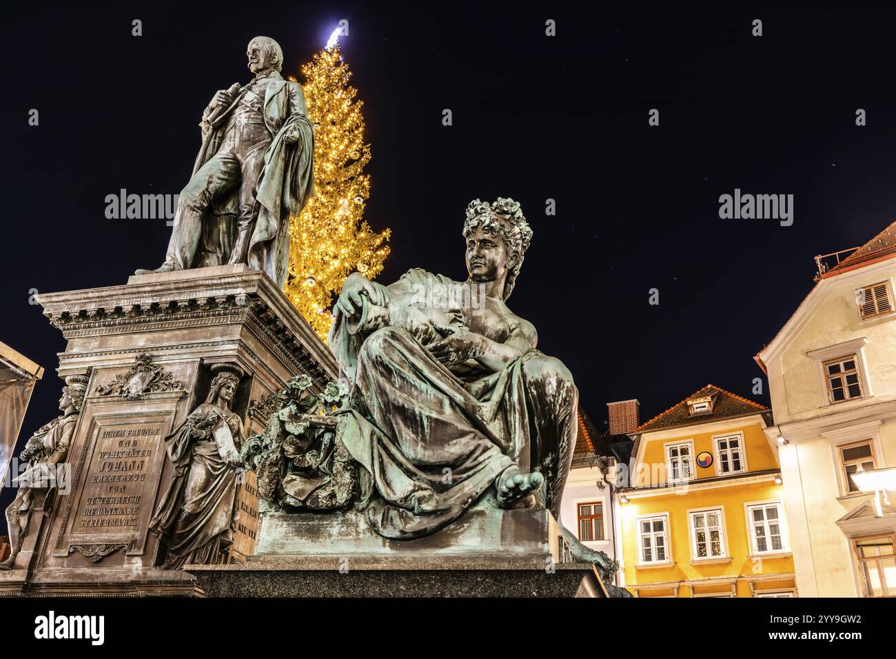 Illuminated Christmas tree, fountain with monument to Archduke Johann ...