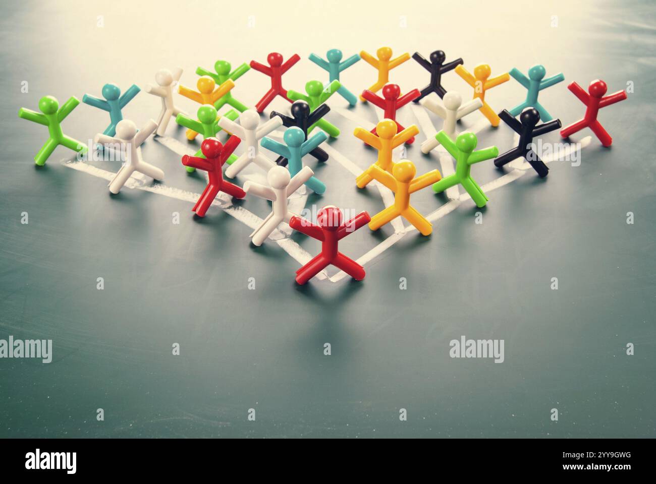 Team work organizational chart concept, colorful dolls on blackboard ...